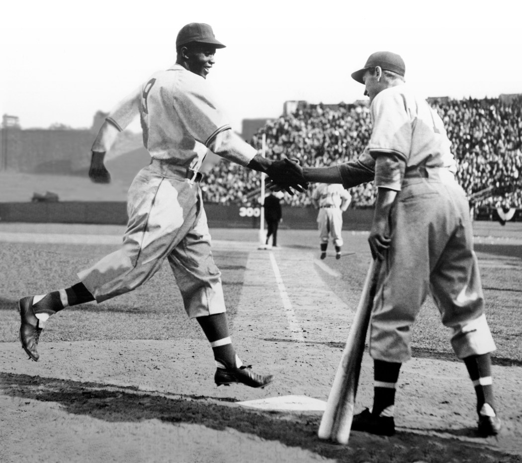 A handshake from a white teammate signaled Jackie Robinson’s arrival in ...